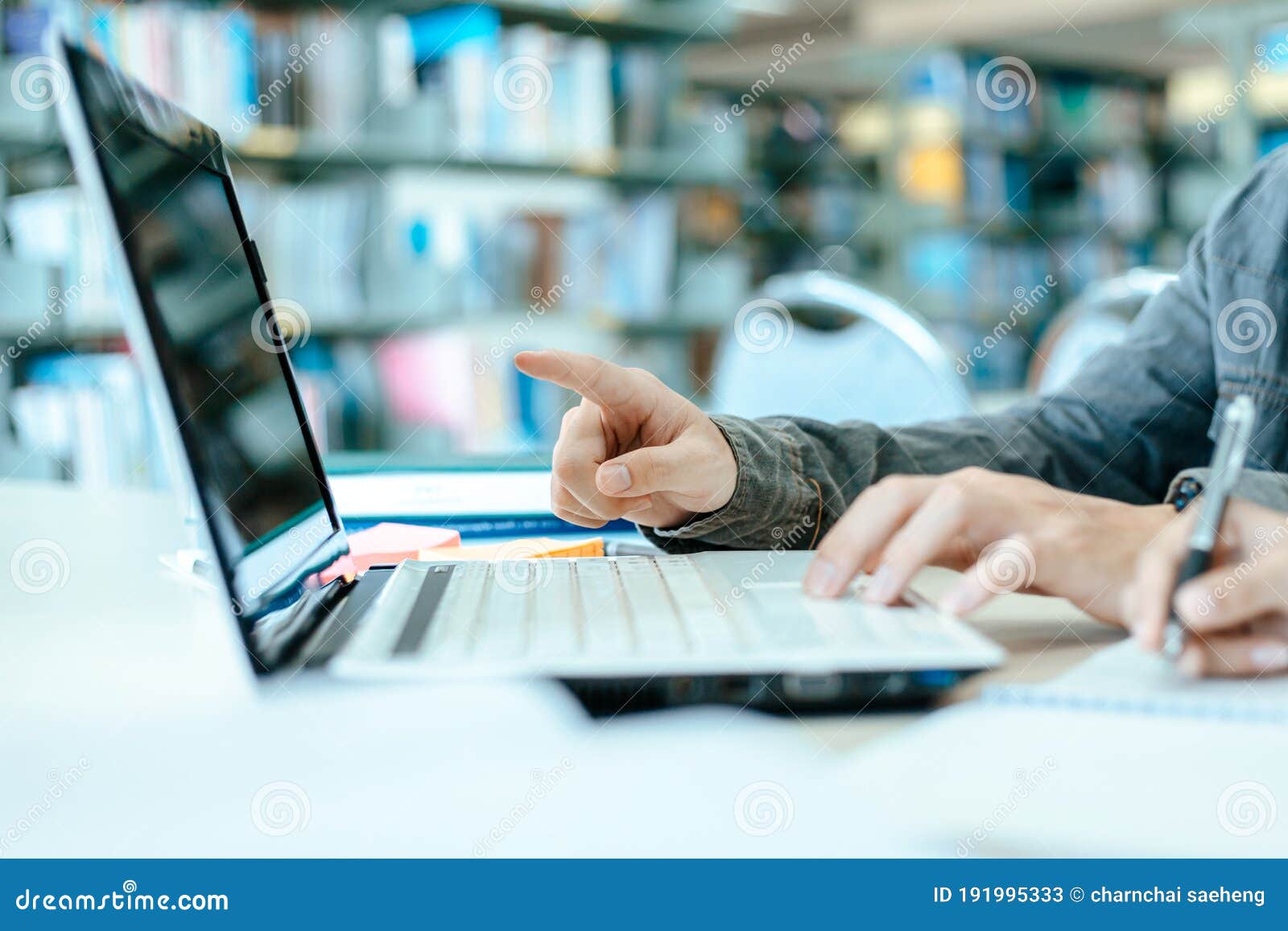 Students Studying in the Library with Laptop at the University ...