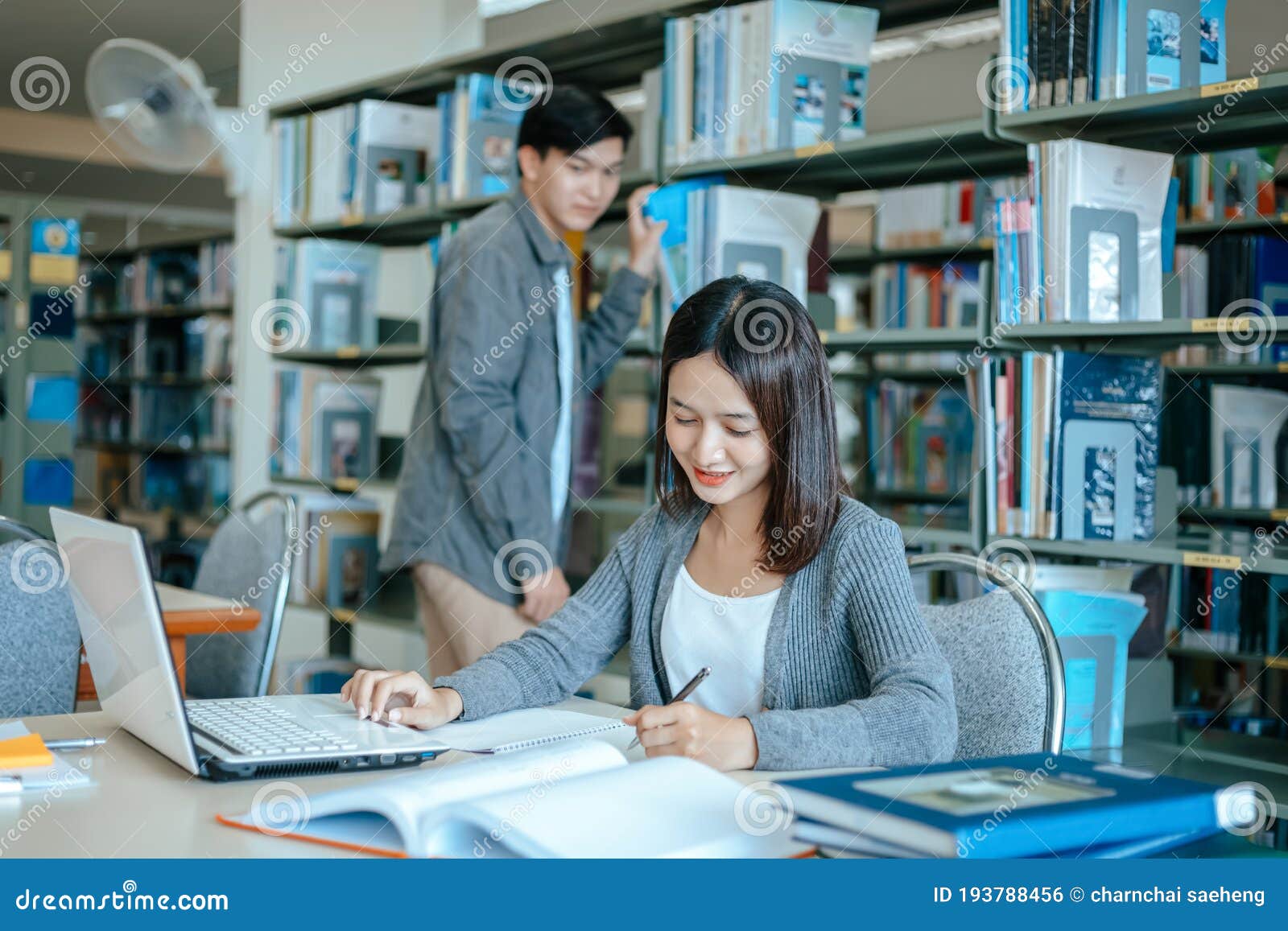 Students Studying in the Library with Laptop at the University ...