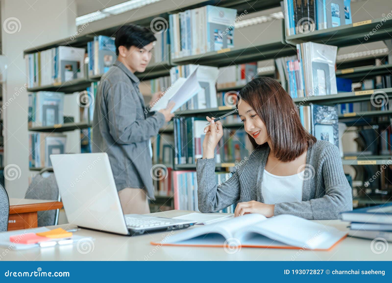 Students Studying in the Library with Laptop at the University ...