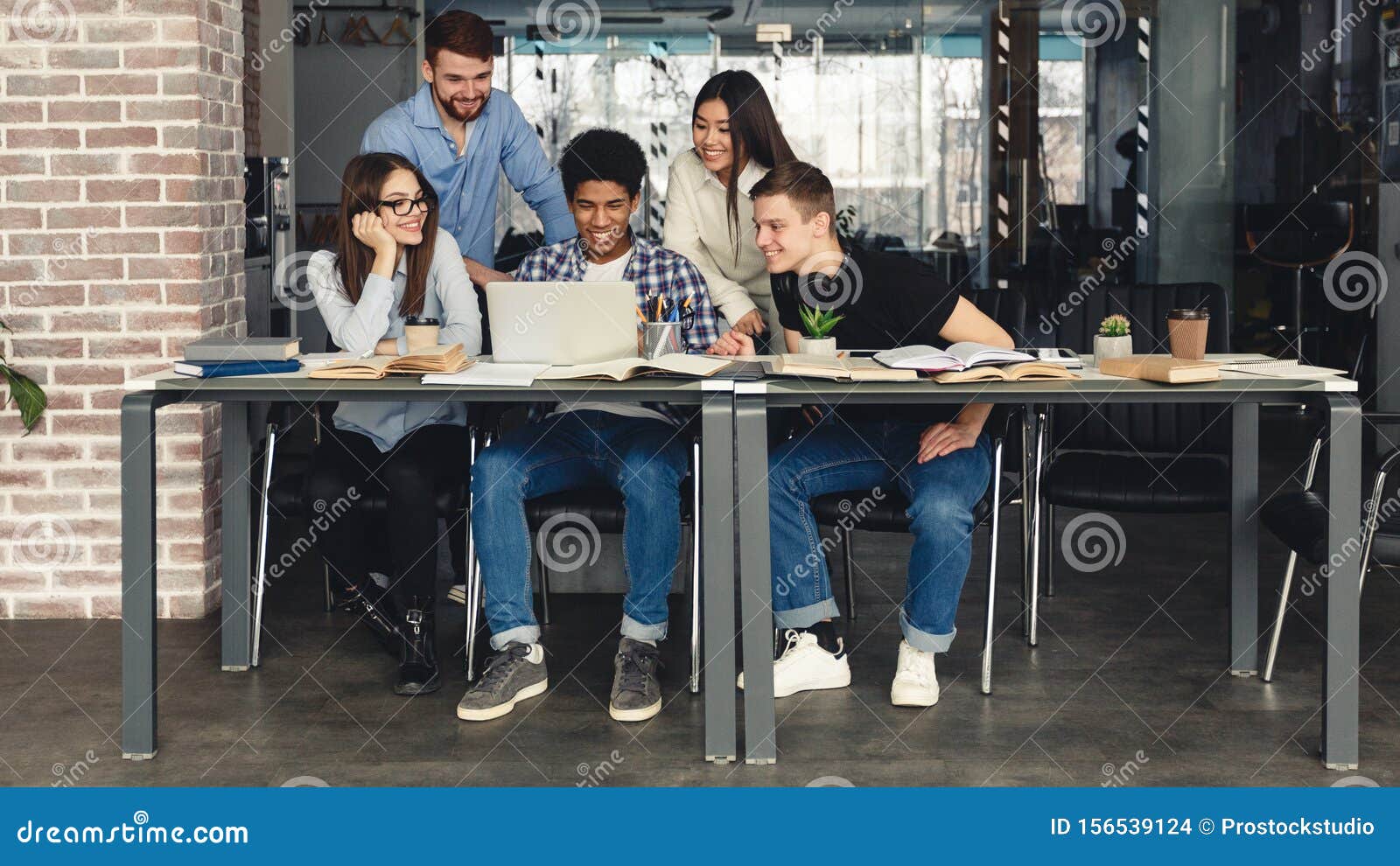 Students Studying in Library Working with Laptop Together Stock Photo ...