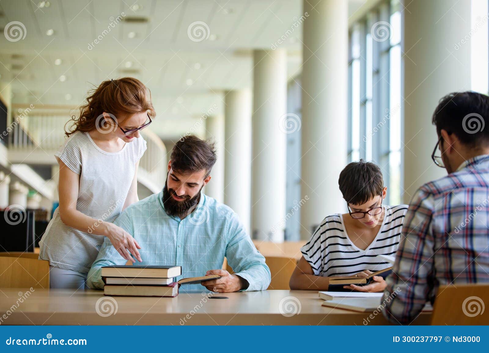 Students Studying in Library. Young Success People are Spending Time Together and Learning ...