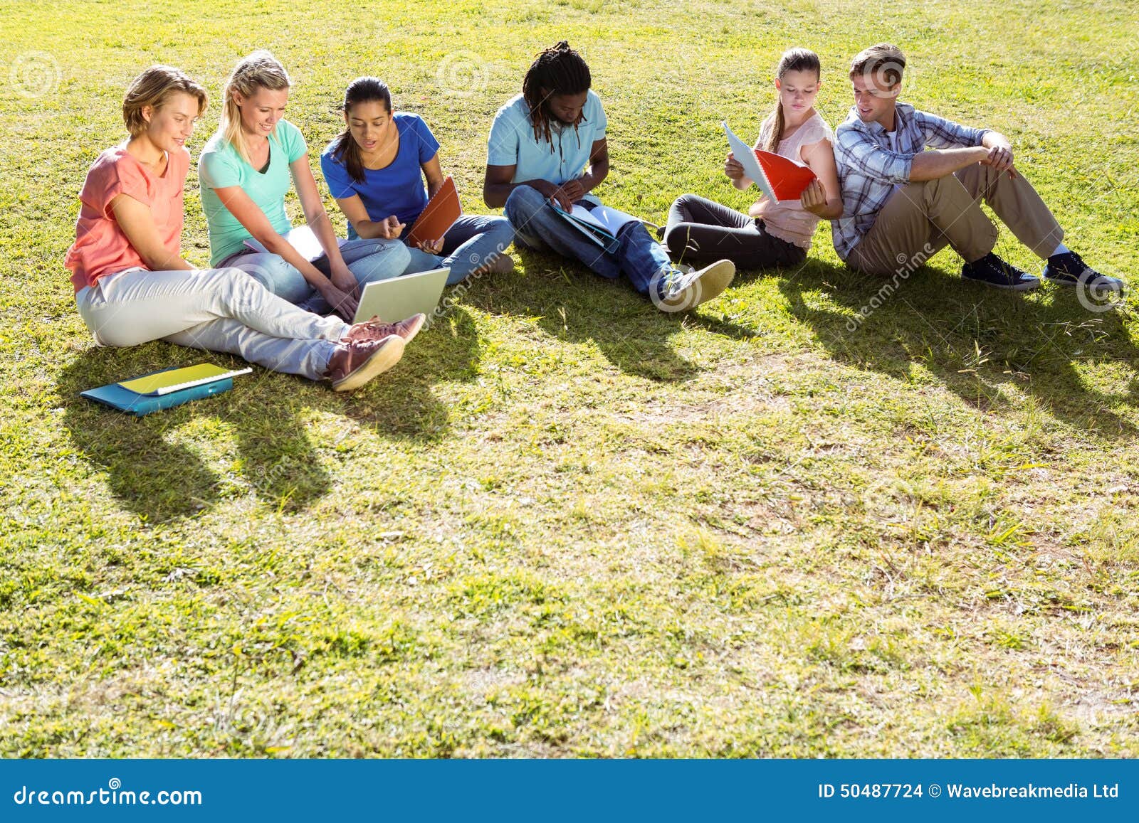 Students Studying Outside on Campus Stock Photo - Image of male, lawn ...