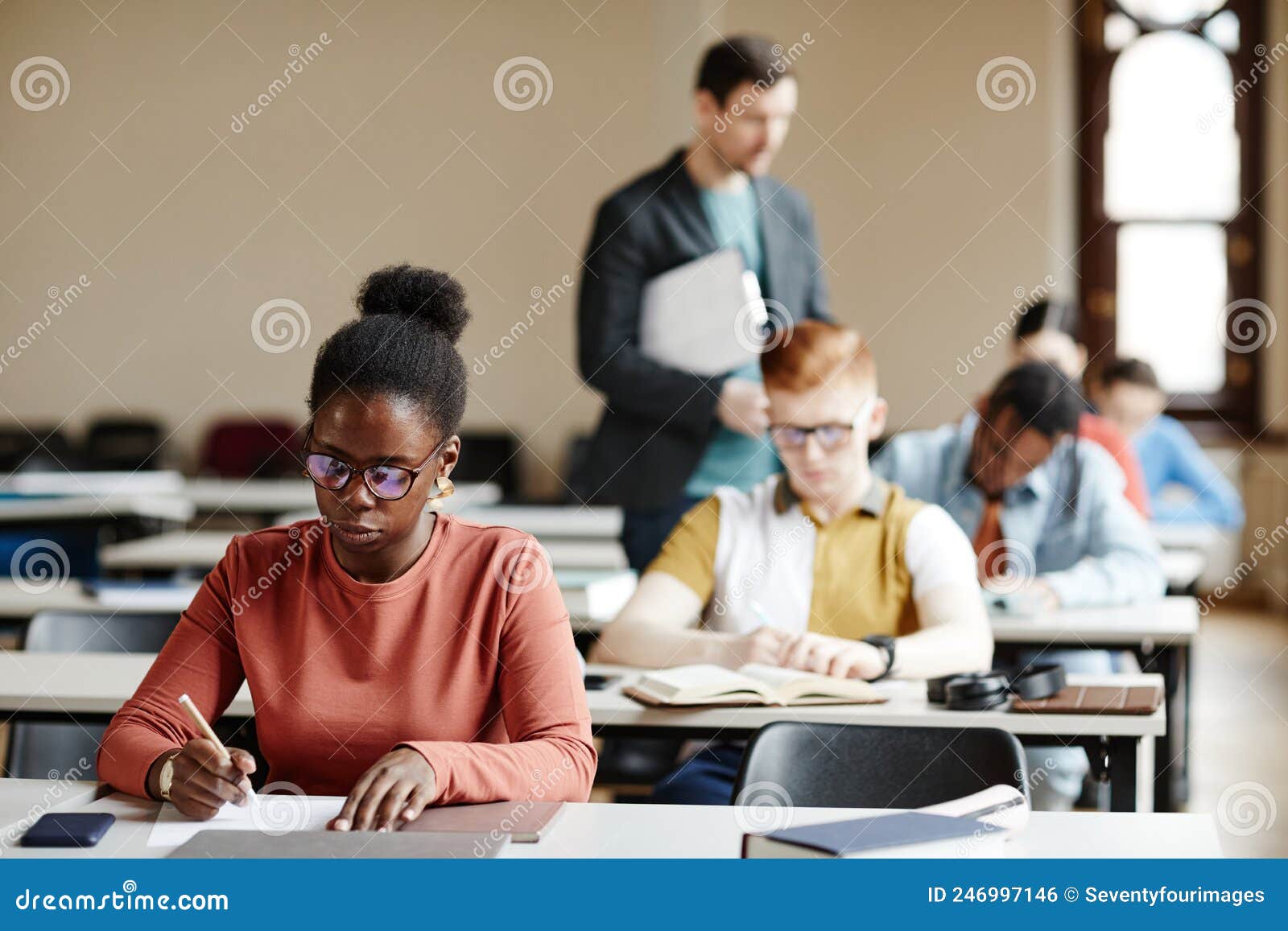 Students Taking Exam in Classroom Stock Photo - Image of education ...