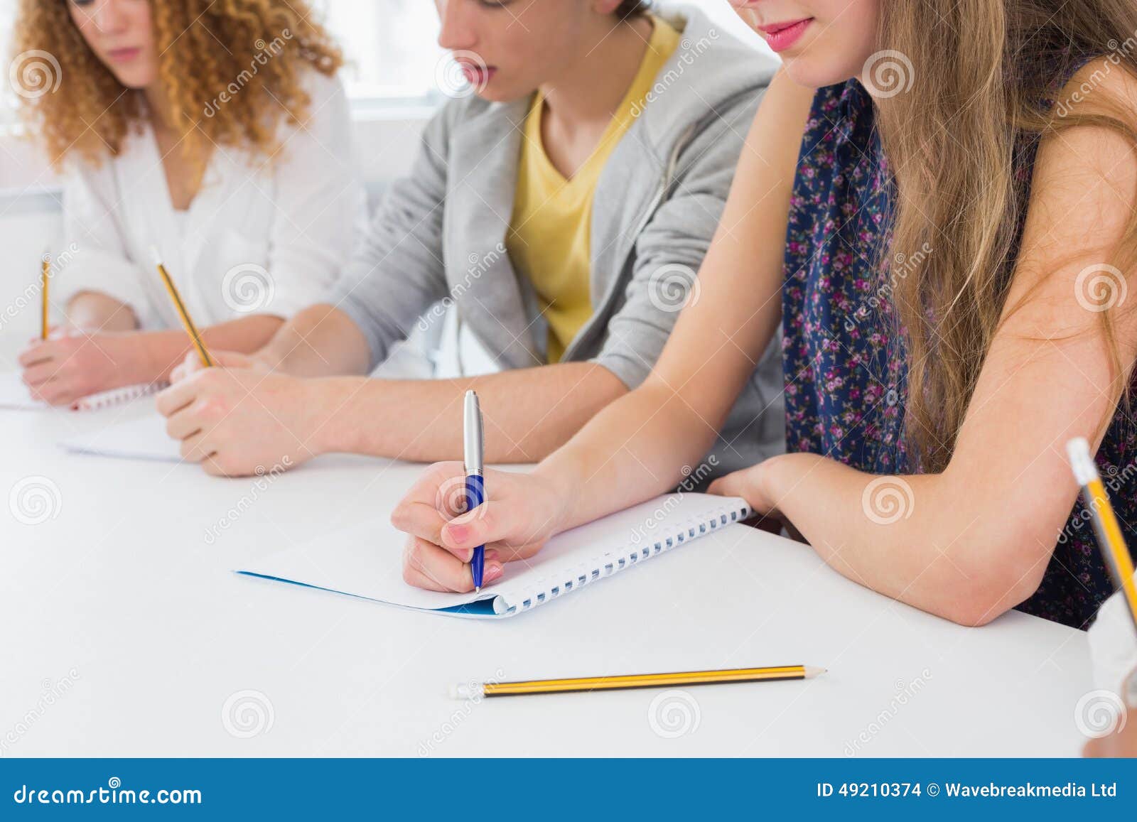 Students Taking Notes in Class Stock Photo - Image of girl, adult: 49210374