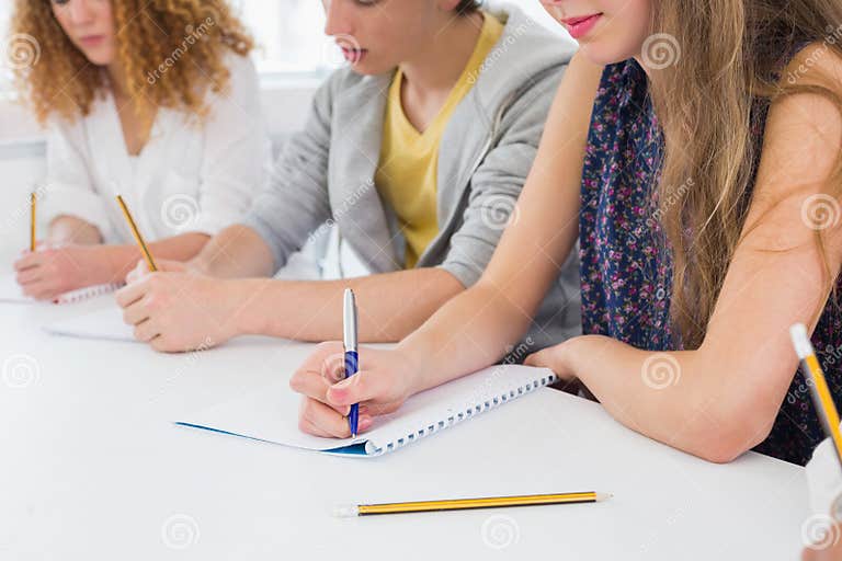 Students Taking Notes in Class Stock Photo - Image of girl, adult: 49210374