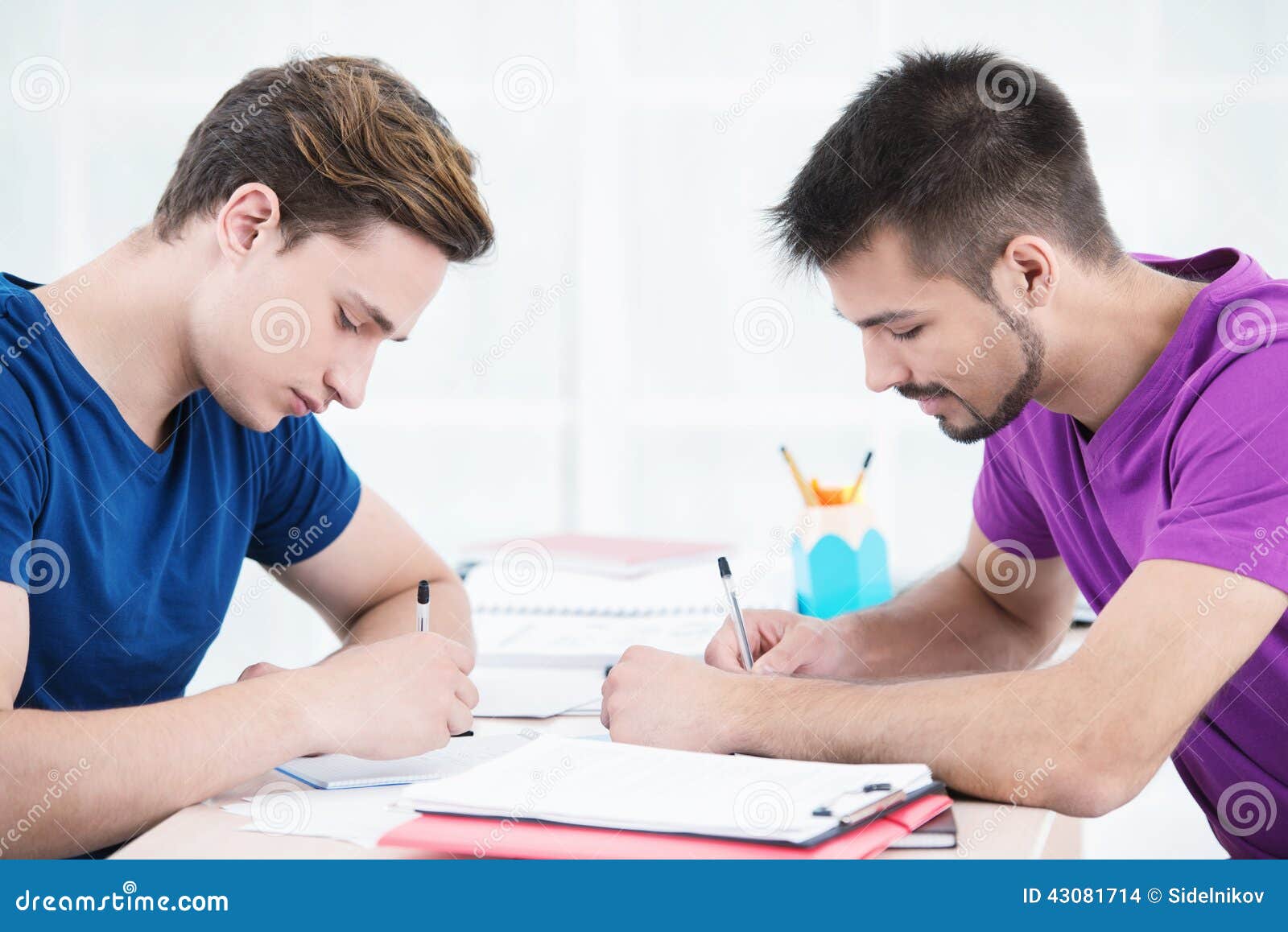 Students Taking Notes in Classroom Stock Photo - Image of paper ...