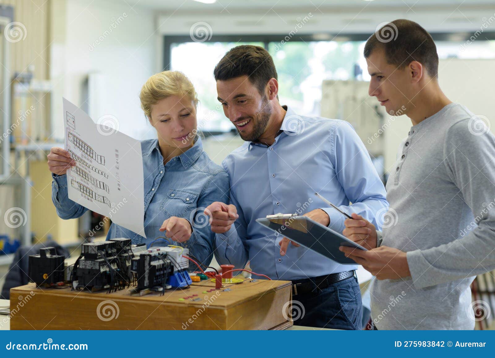 Students Taking Notes in Engineering Laboratory with Teacher Stock ...