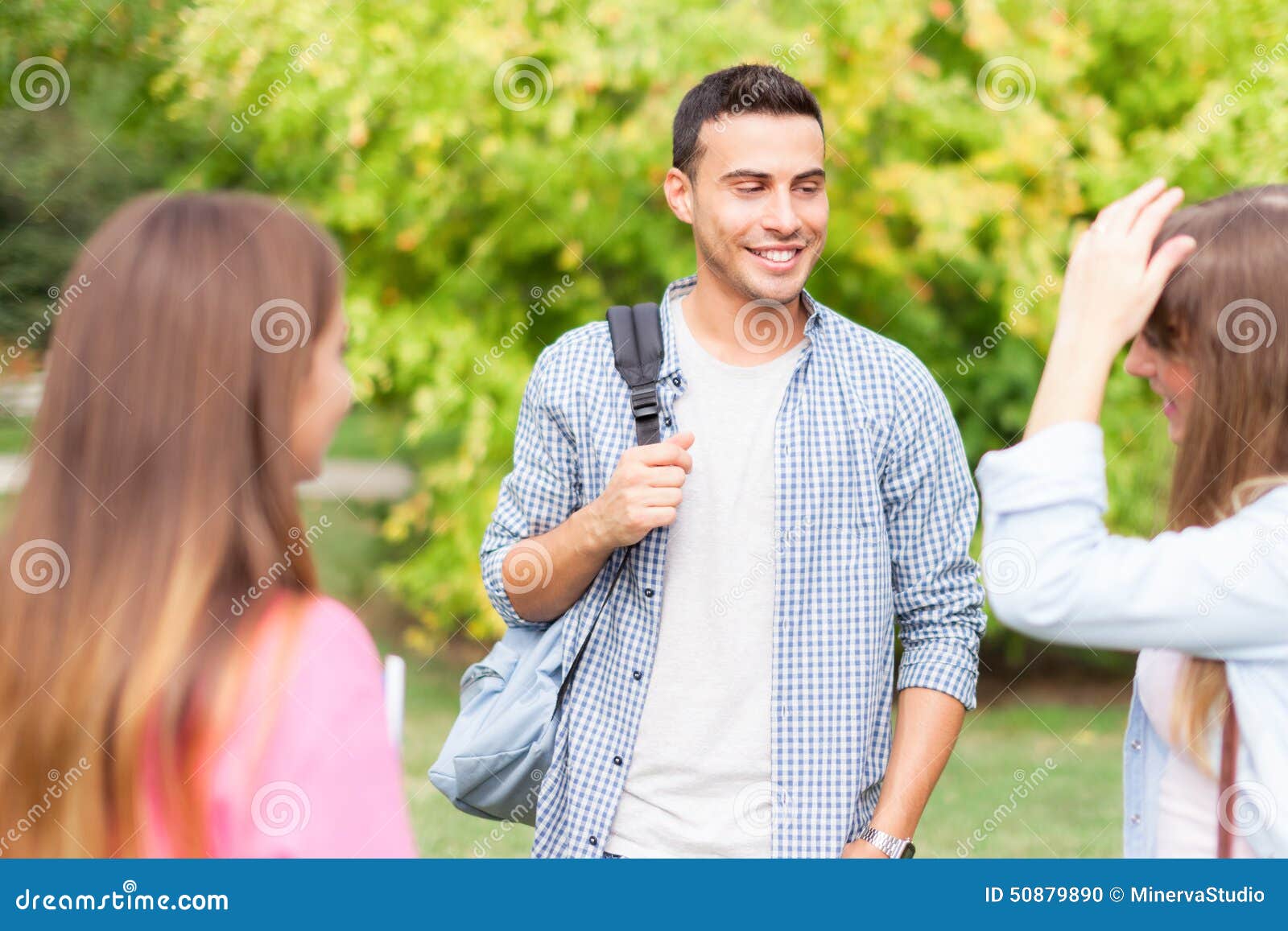 Students talking in a park stock photo. Image of class - 50879890