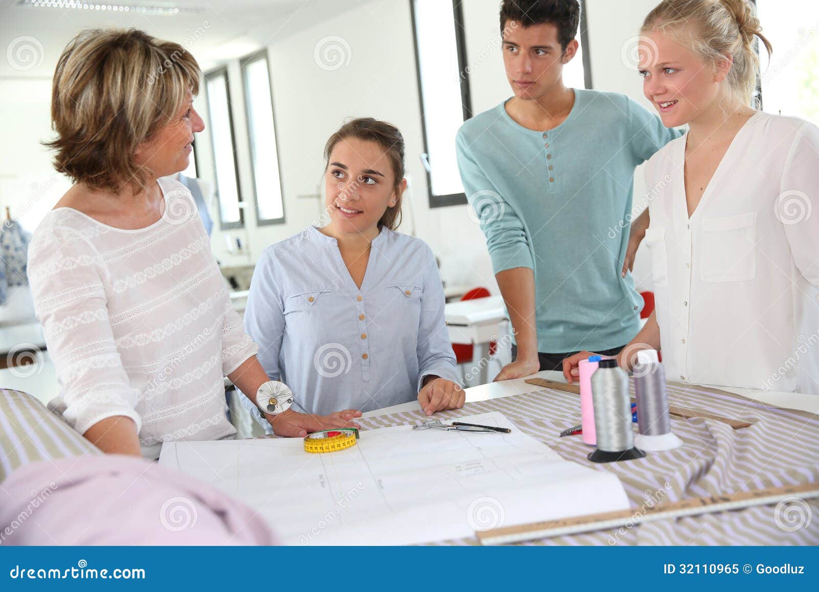 Students with Teacher in Dressmaking Class Stock Image - Image of young ...