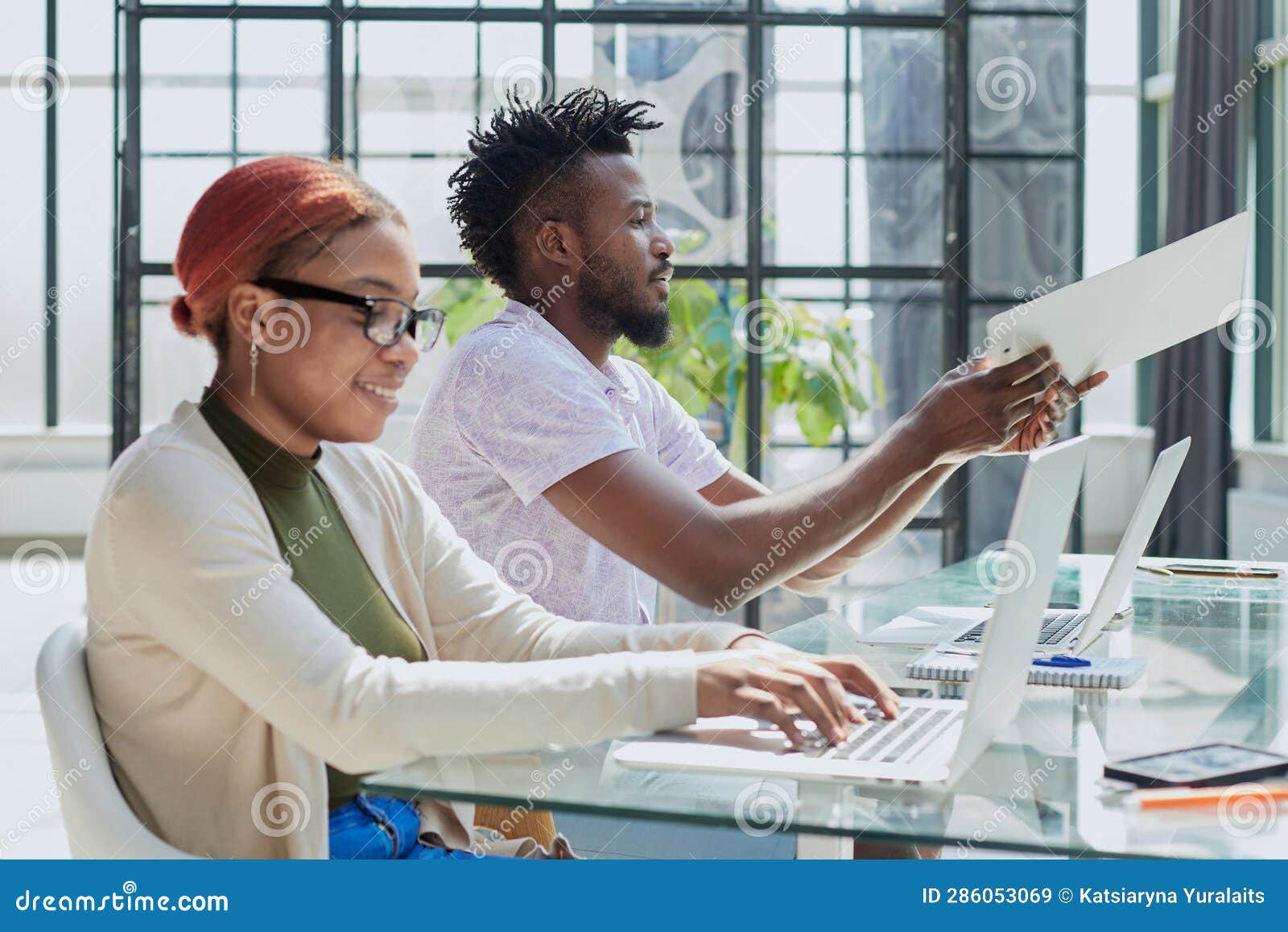 A Group of Young Students are Being Trained on a Computer in a Training ...