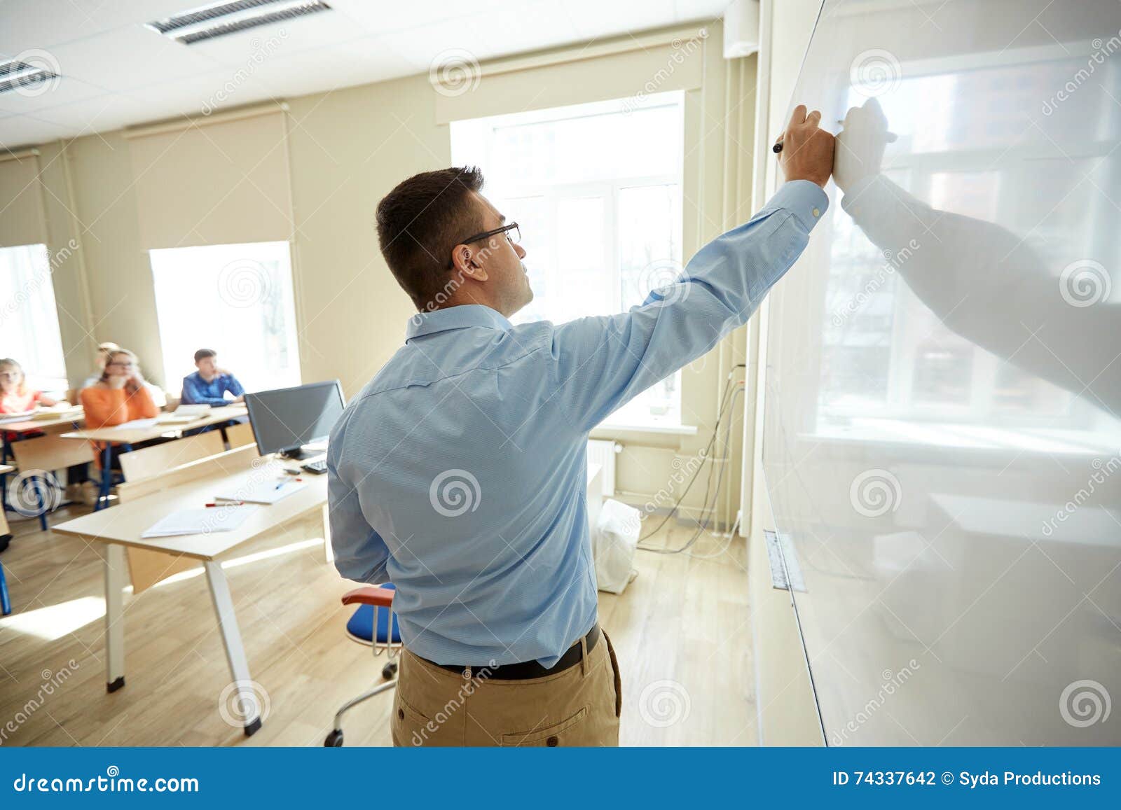 Students And Teacher Writing On School White Board Stock Photo ...