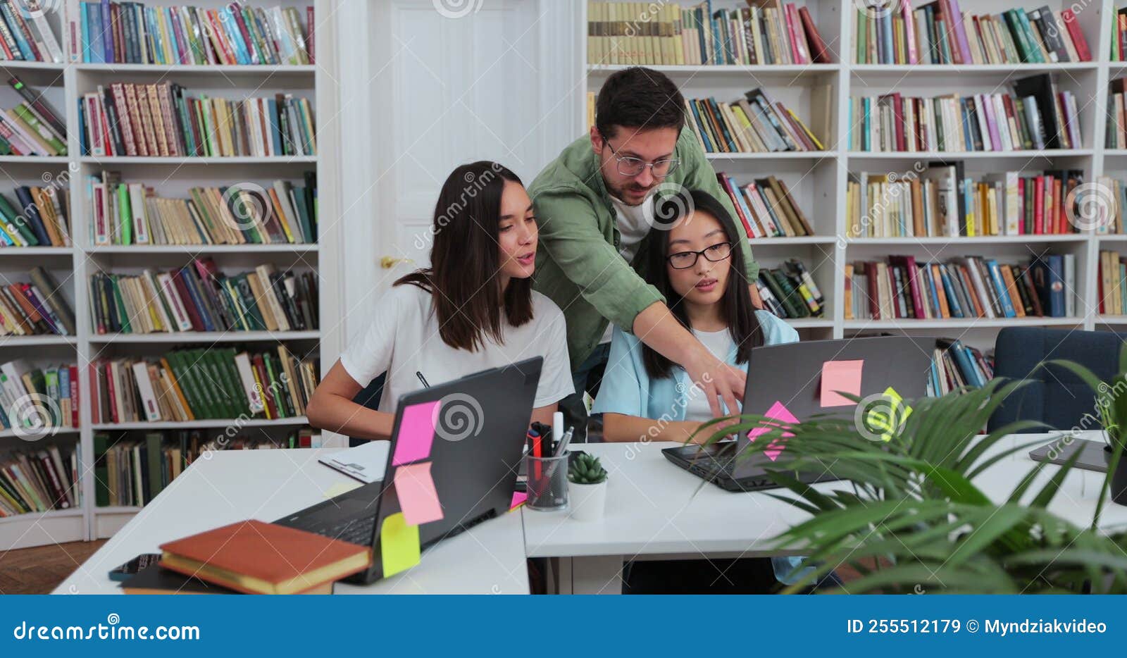 Students Team Study Together Using Laptop Prepare for Exam in Library ...