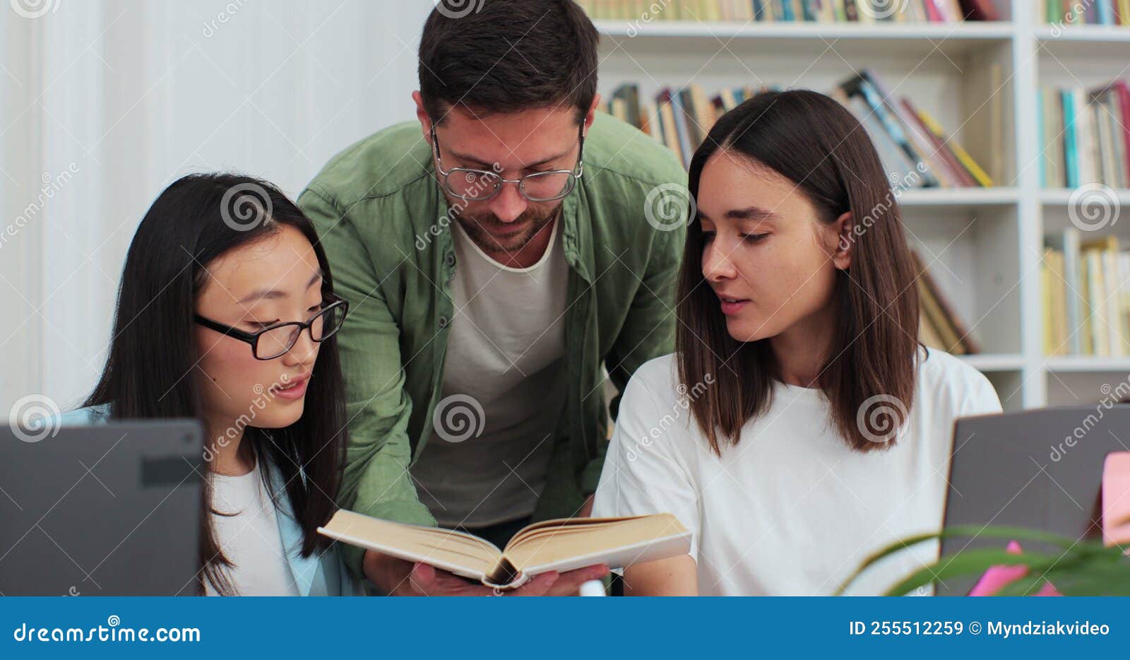 Students Team Study Together Using Laptop Prepare for Exam in Library, Multiethnic Young People ...