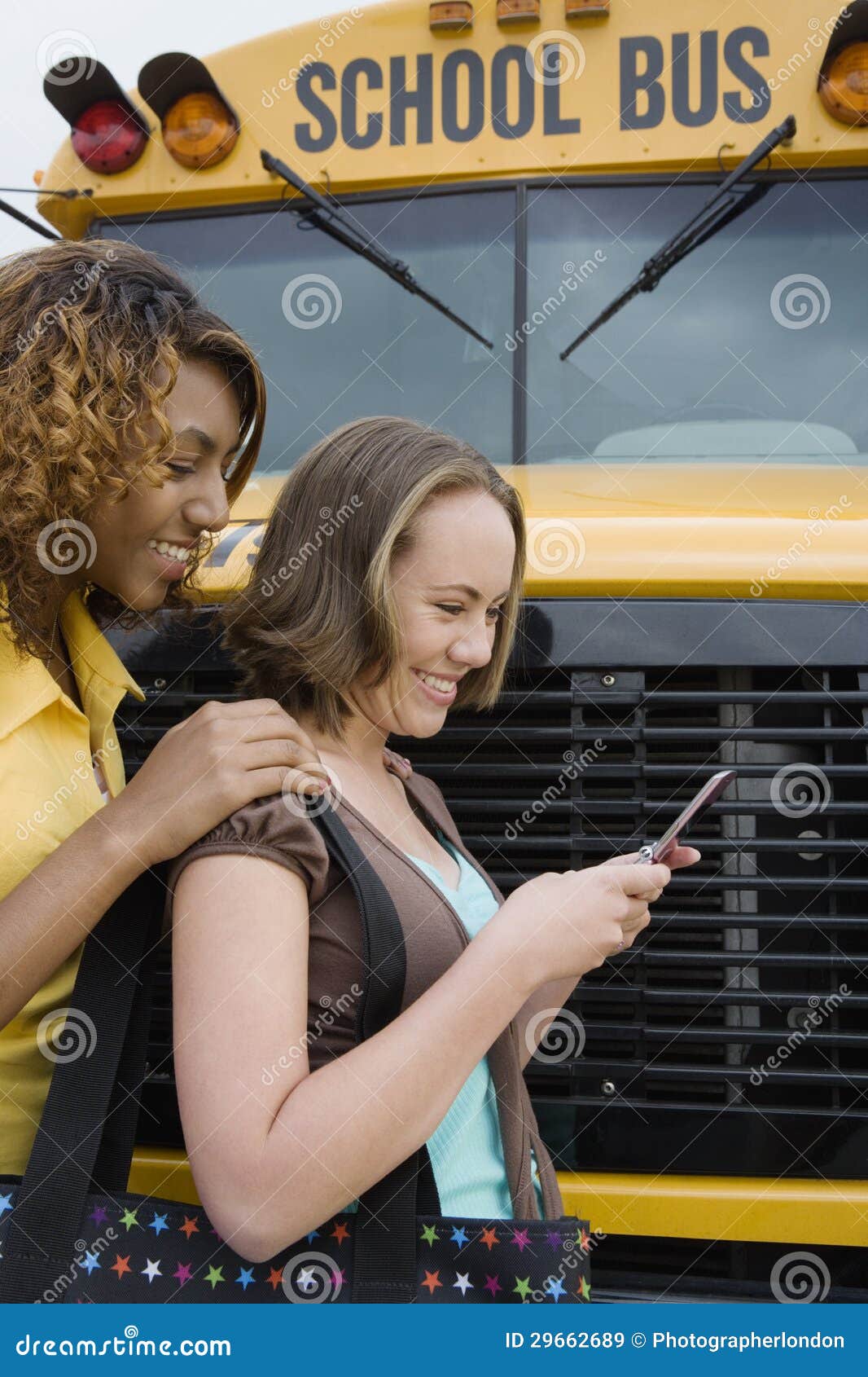 Students Text Messaging by School Bus Stock Image - Image of automobile ...