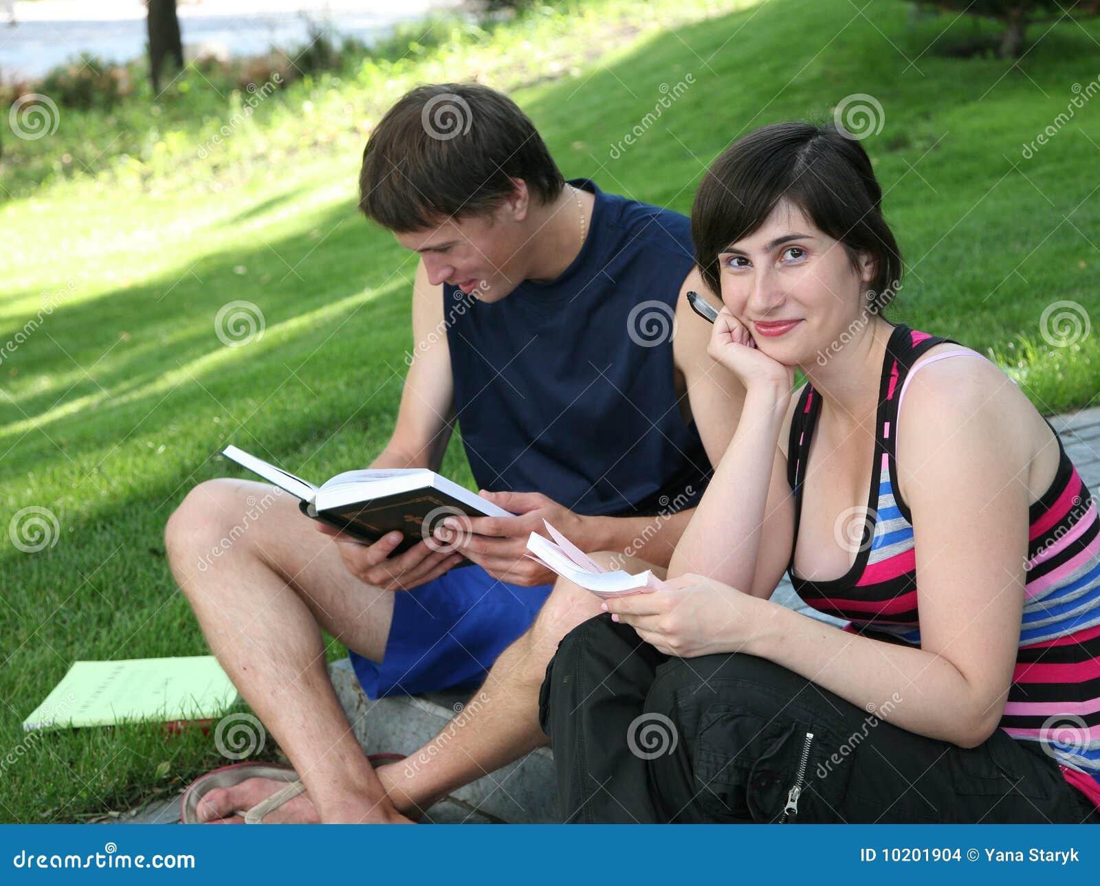 Students with textbooks stock photo. Image of grass, students - 10201904