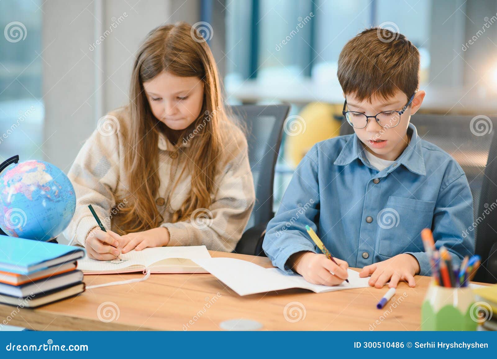 Students To Schoolwork during Lesson in Light Classroom at School Stock ...