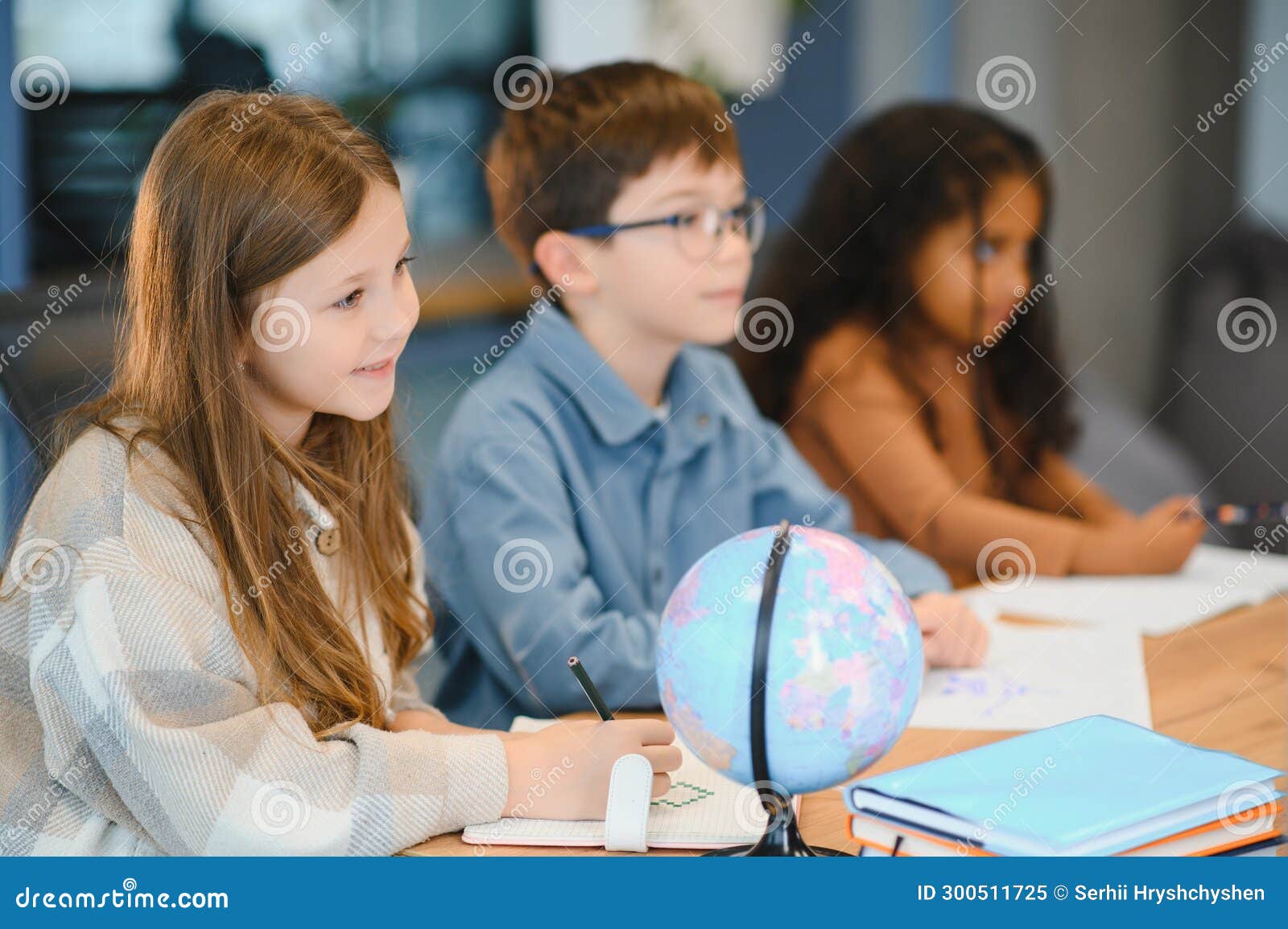 Students To Schoolwork during Lesson in Light Classroom at School Stock ...