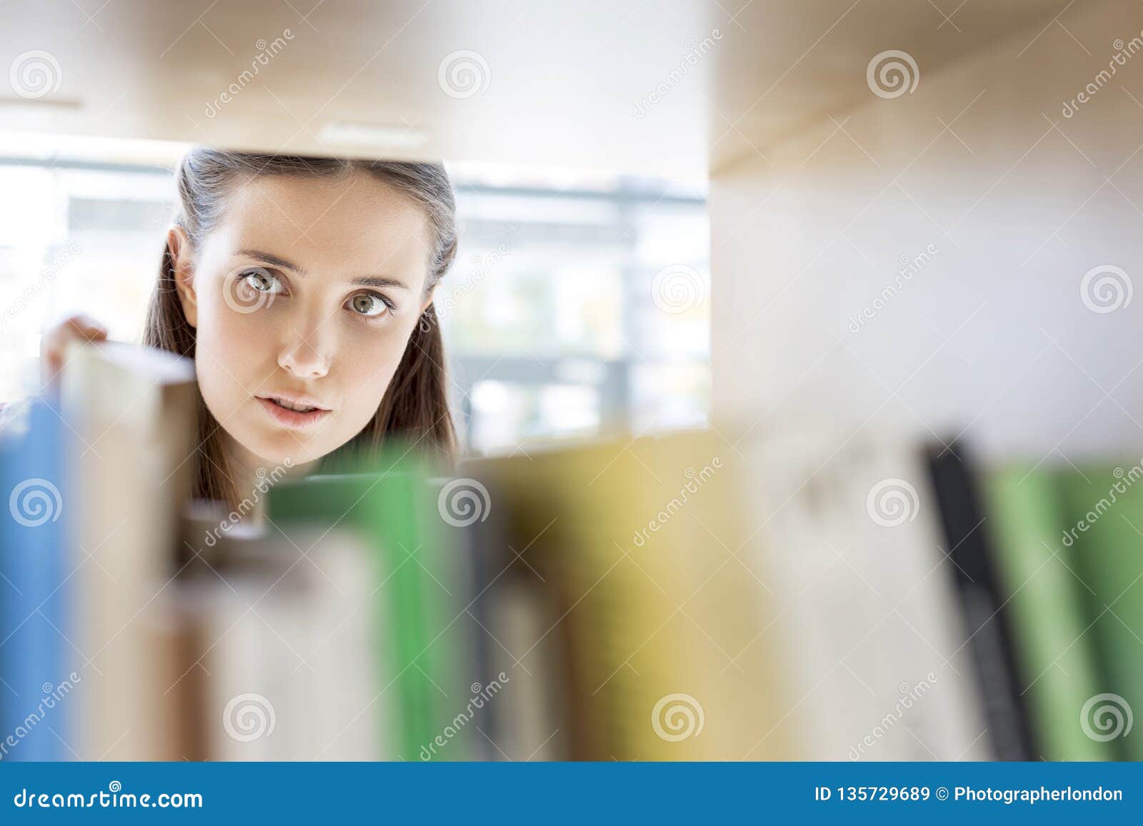 Closeup of Young Student Searching Book on Shelf at Library Stock Image ...