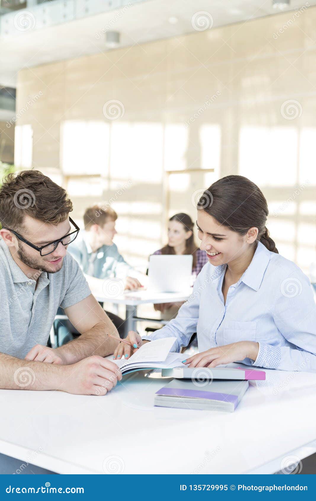 Students Learning Together at Table in University Library Stock Image ...