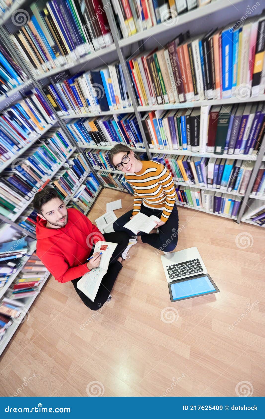 The Students Uses a Notebook, Laptop and a School Library Stock Image ...