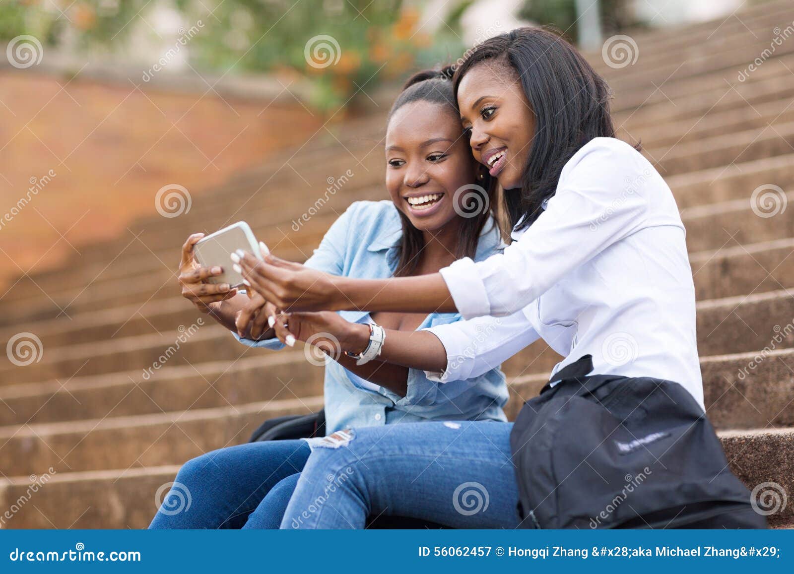 Students using cell phone stock image. Image of learner - 56062457