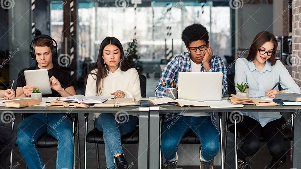 Students Using Different Gadgets Studying in Library Stock Image ...