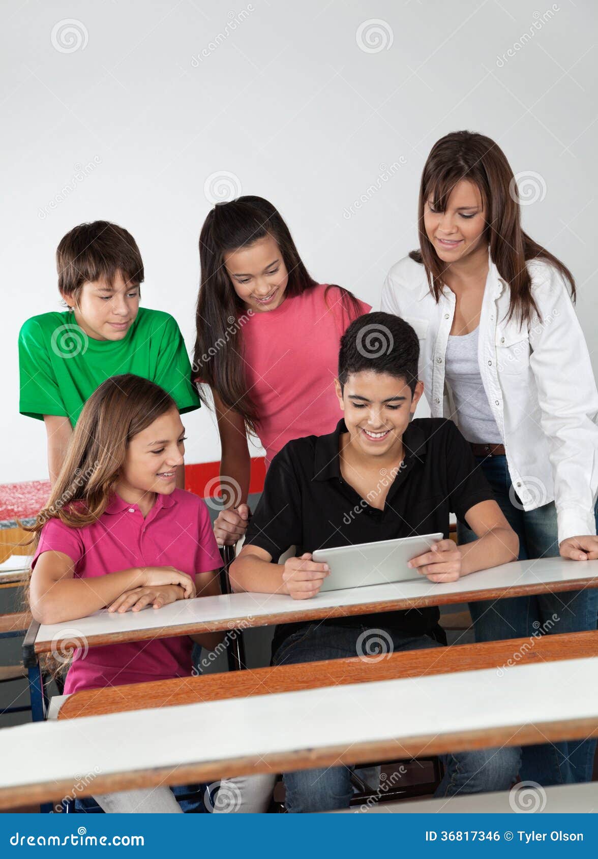 Students Using Digital Tablet at Desk Stock Photo - Image of people ...