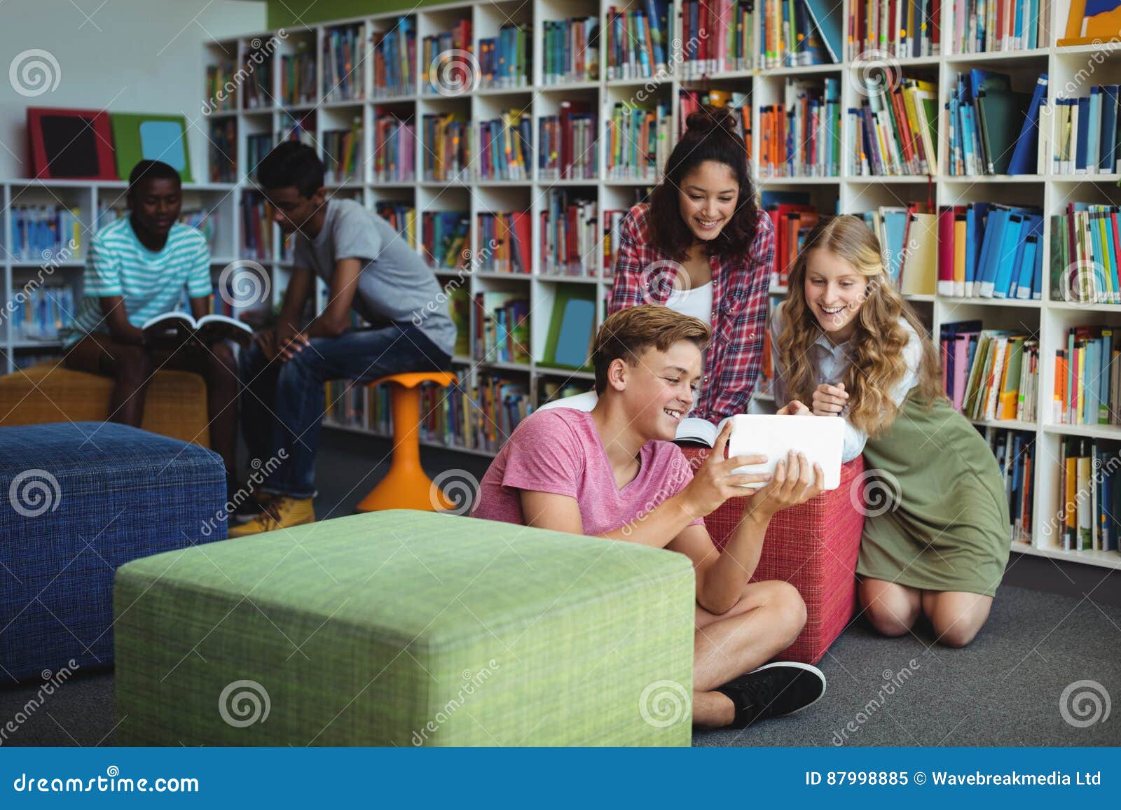 Students Using Digital Tablet in Library Stock Image - Image of child ...