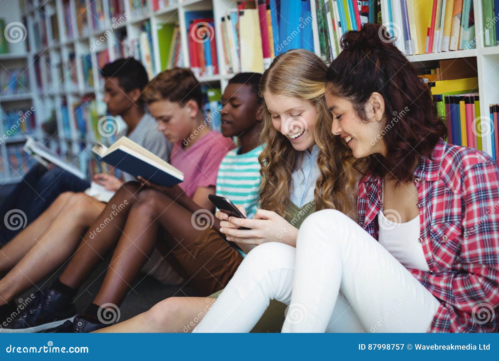 Students Using Mobile Phone in Library Stock Image - Image of classmate ...