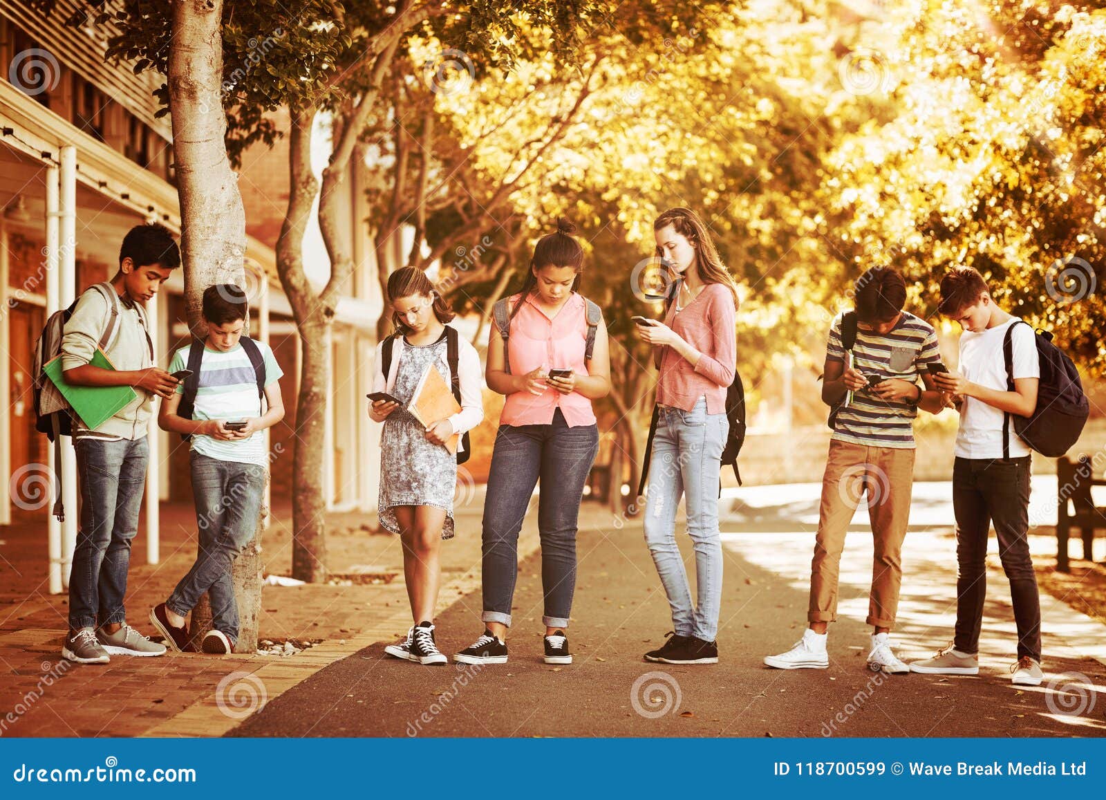 Students Using Mobile Phone on Road in Campus Stock Image - Image of ...