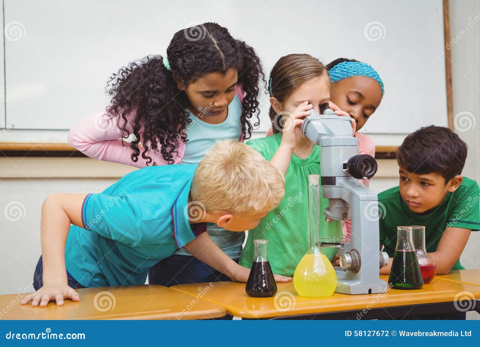 Students Using Science Beakers And A Microscope Stock Photography ...
