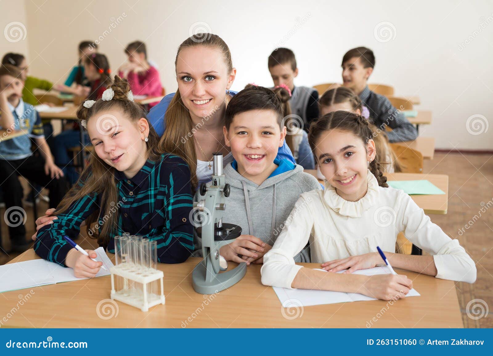 Students Using Science Beakers and a Microscope at the Elementary ...