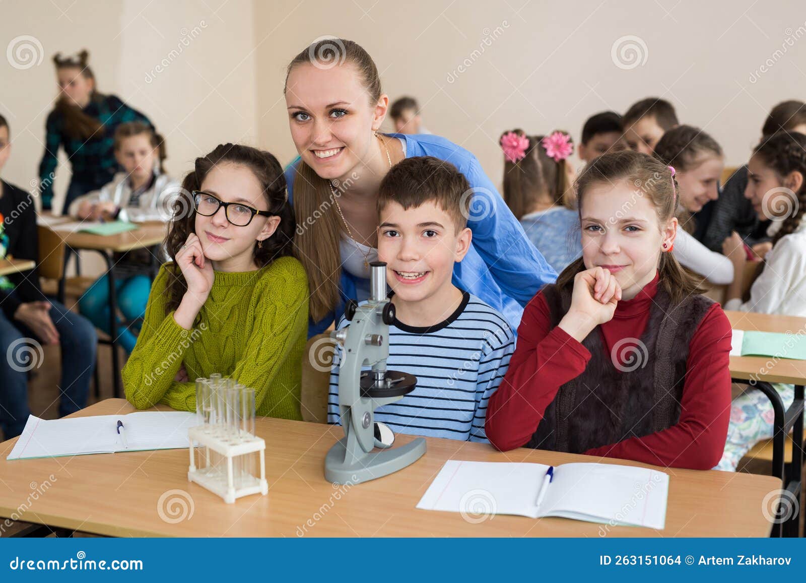 Students Using Science Beakers and a Microscope at the Elementary ...