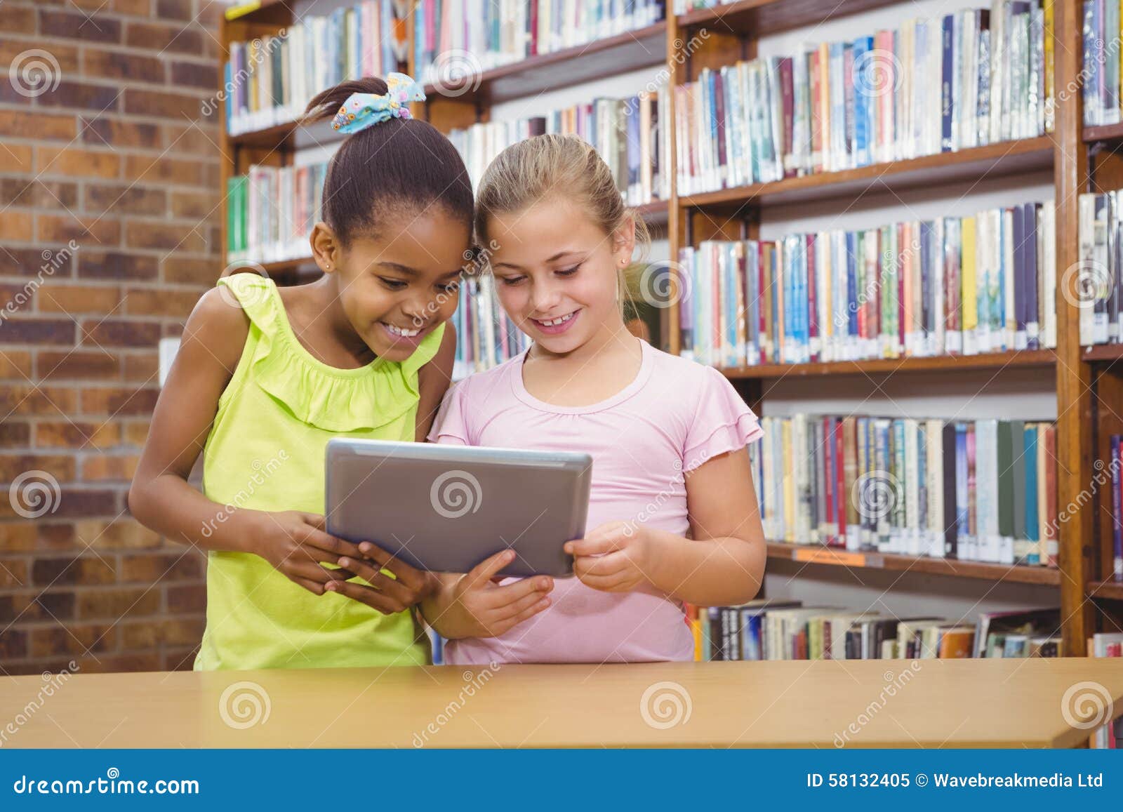 Students Using a Tablet Pc Together Stock Image - Image of female ...