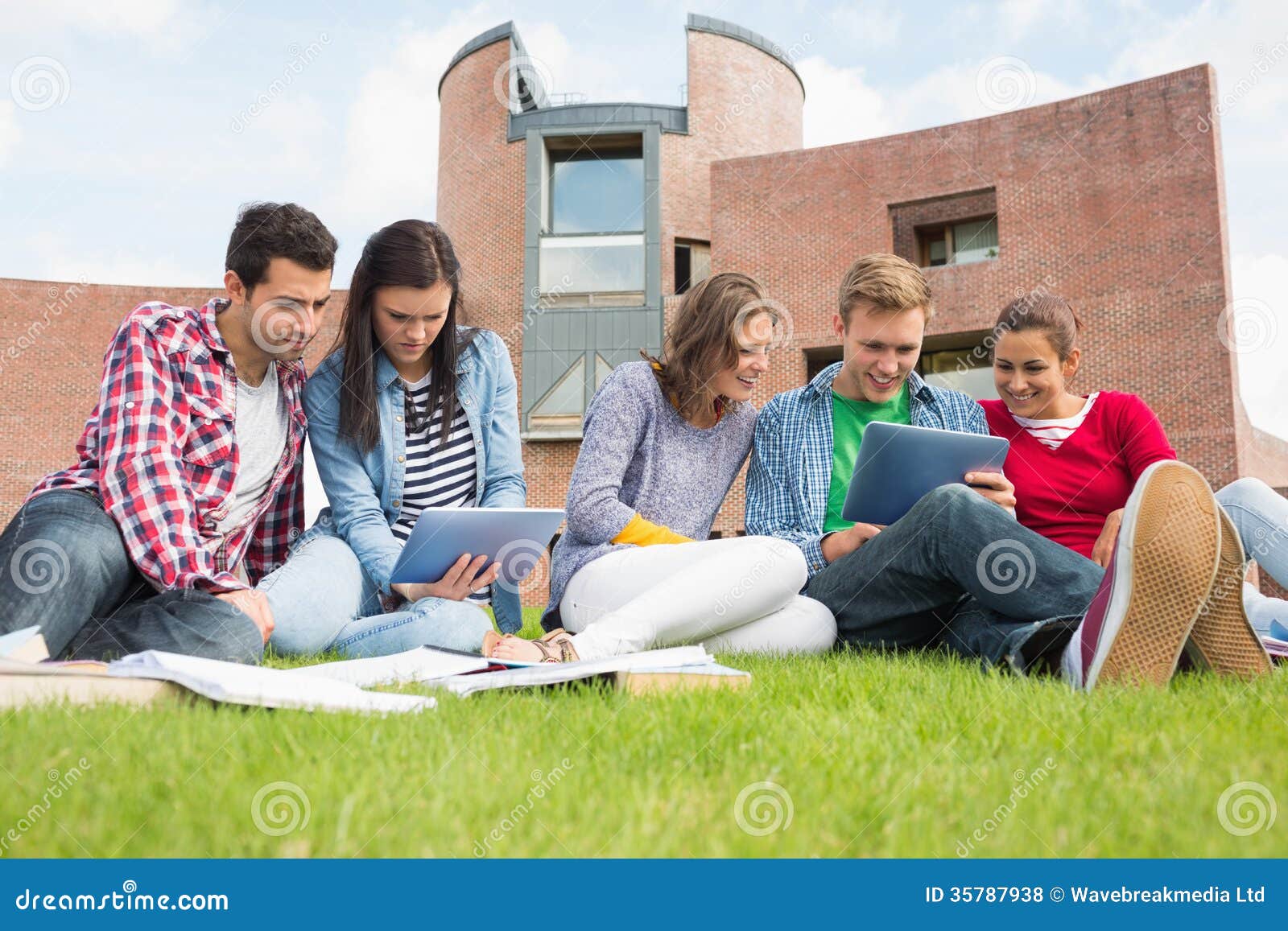 Students Using Tablet PCs in the Lawn Against College Building Stock ...