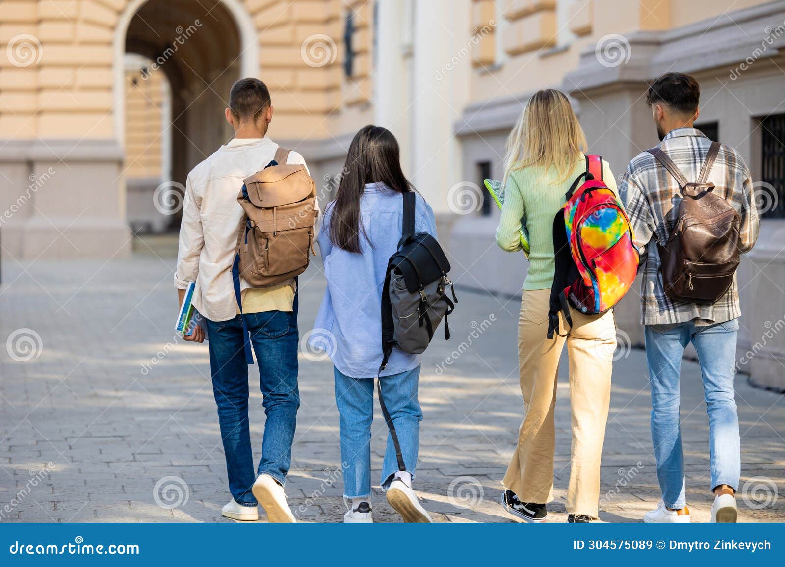 Students Walking in College Campus after Classes Carrying Backpacks ...