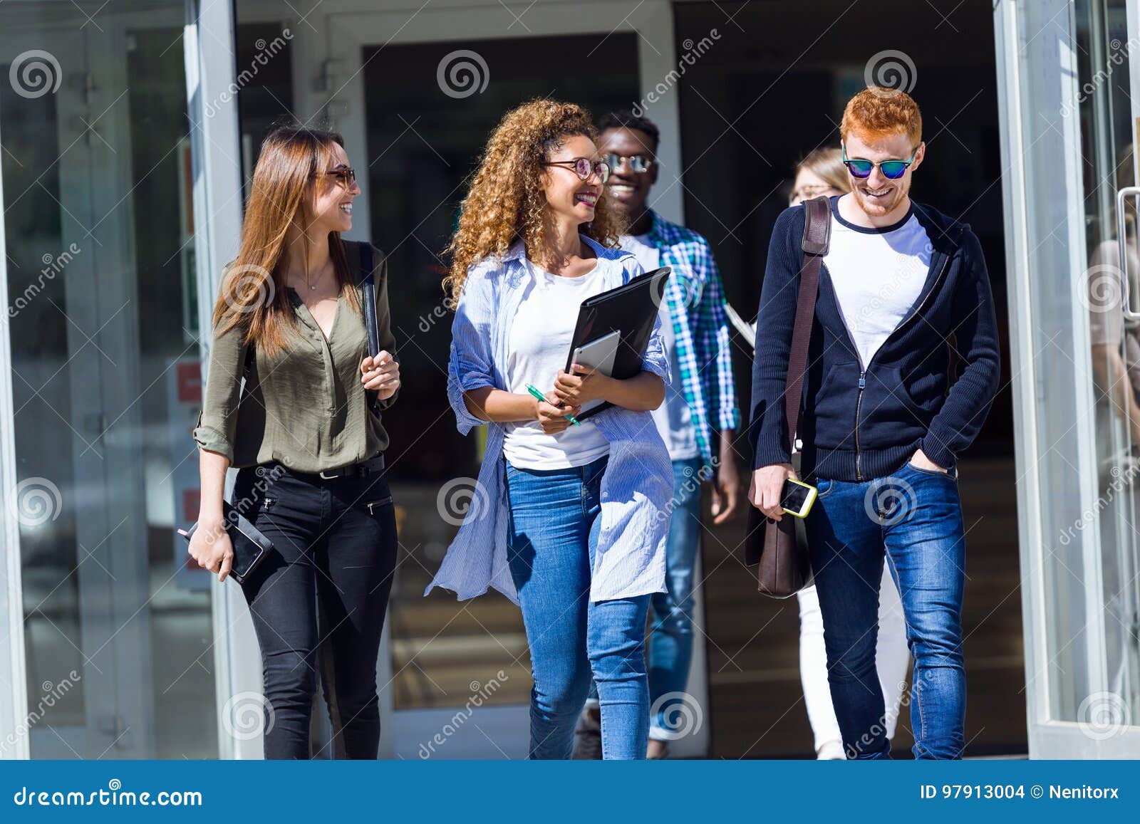 Students are Walking in University Hall during Break and Communicating ...