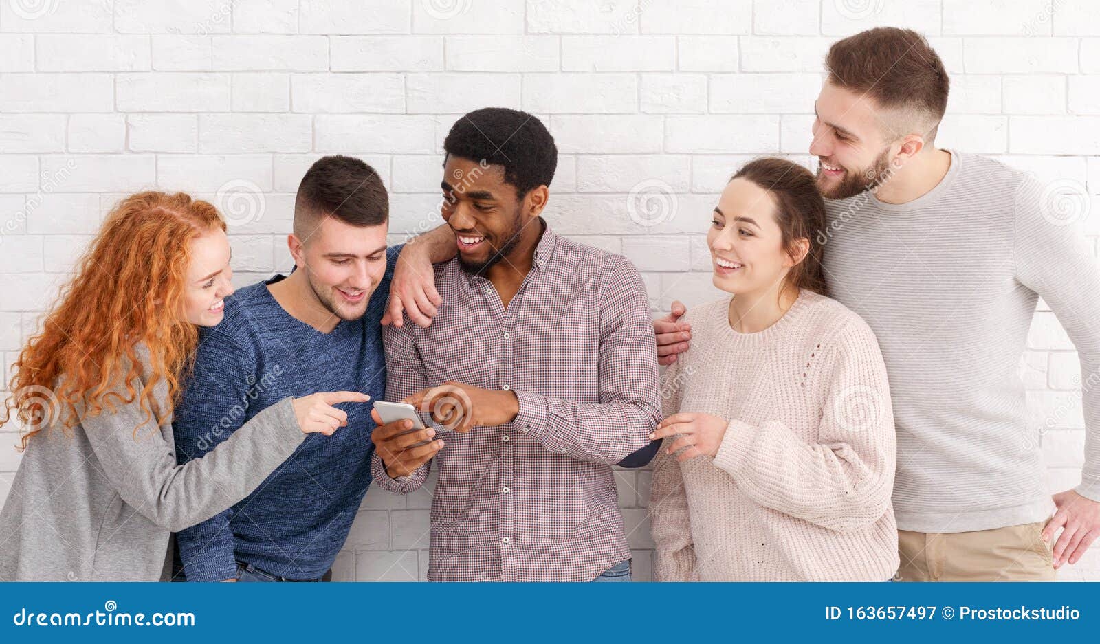 Students Watching Funny Content on Phone Over White Wall Stock Image ...