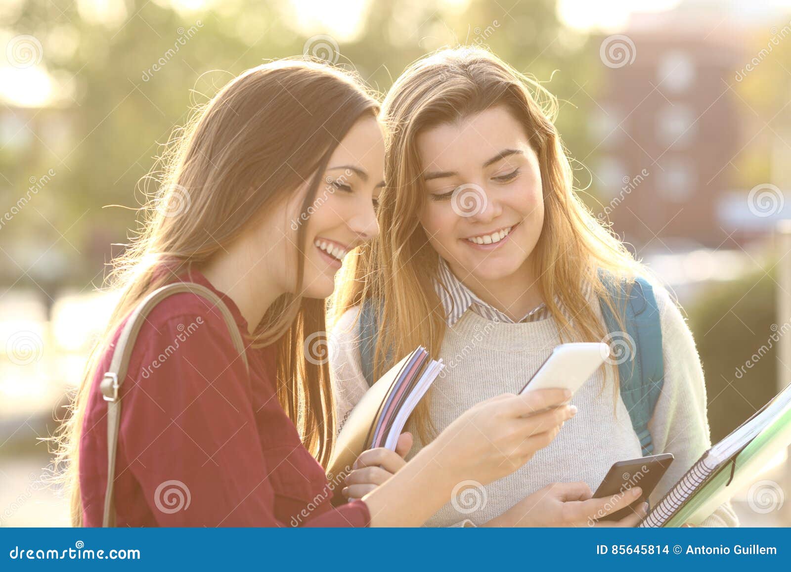 Students Watching Media in a Smart Phone Stock Photo - Image of meeting ...