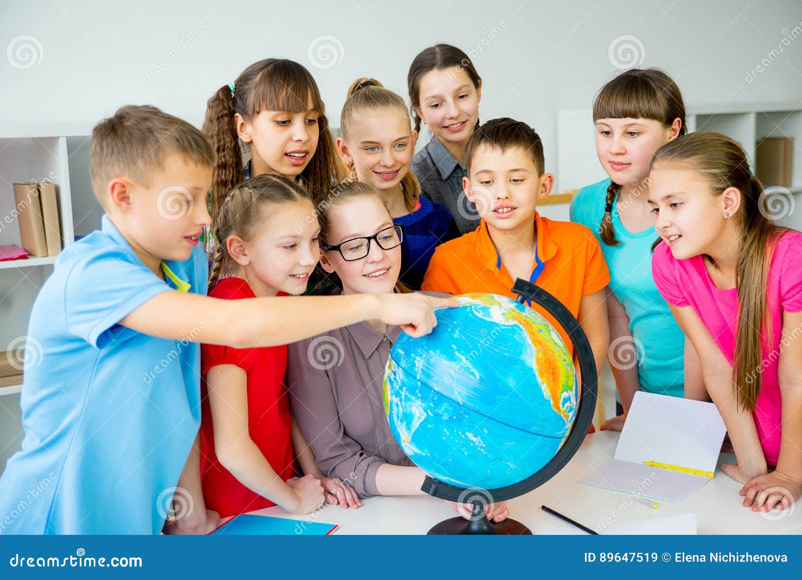 Students work with teacher stock image. Image of child - 89647519