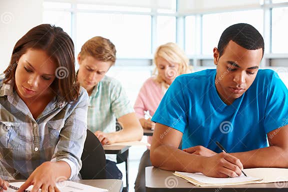 Students Working in Classroom Stock Photo - Image of serious, learning ...