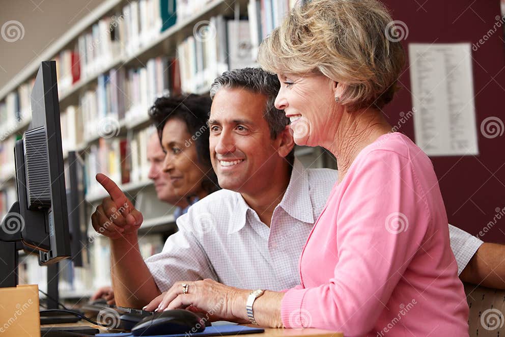 Students Working on Computers in Library Stock Photo - Image of lying ...