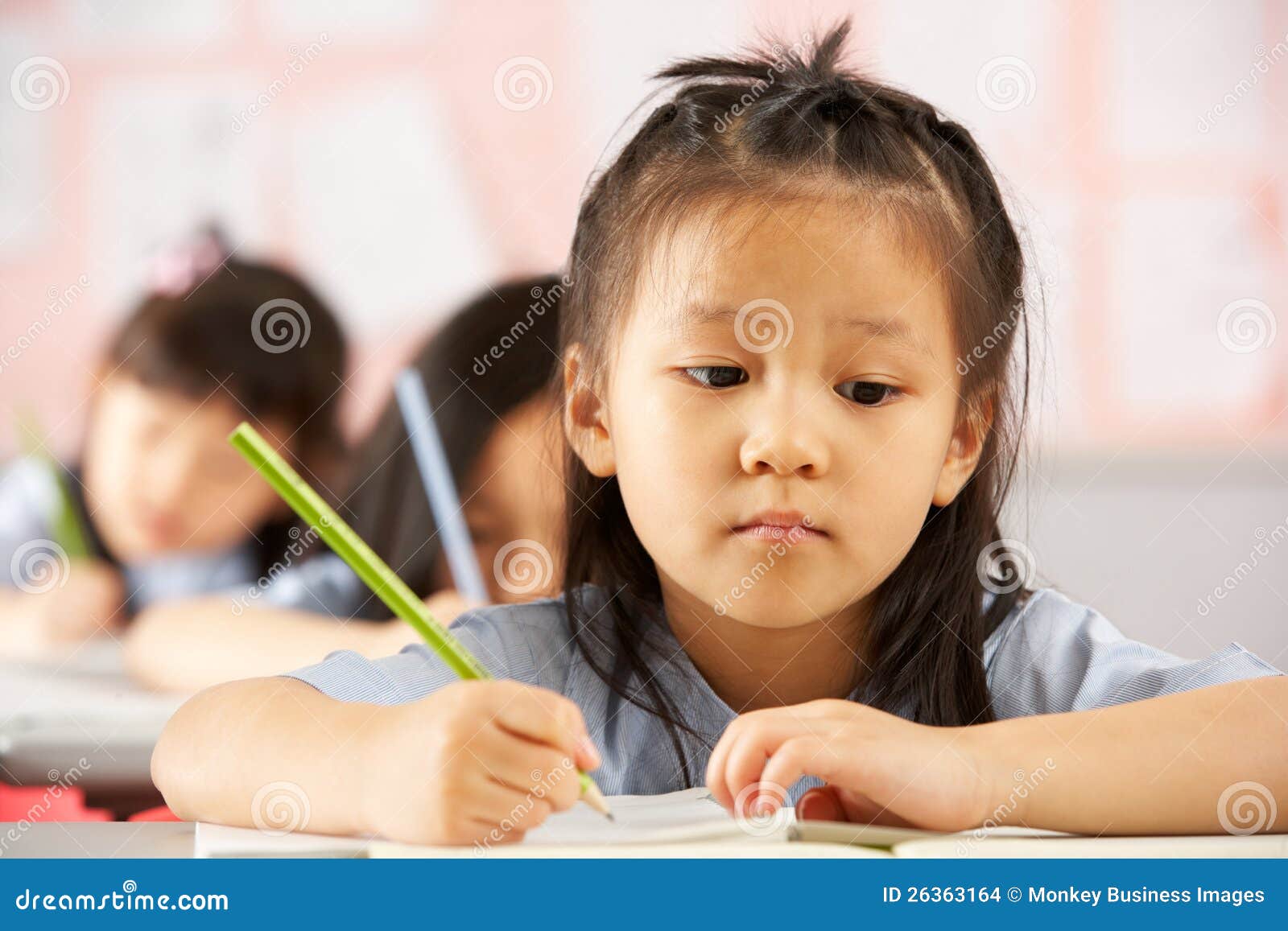 Students Working at Desks in Chinese School Stock Photo - Image of ...