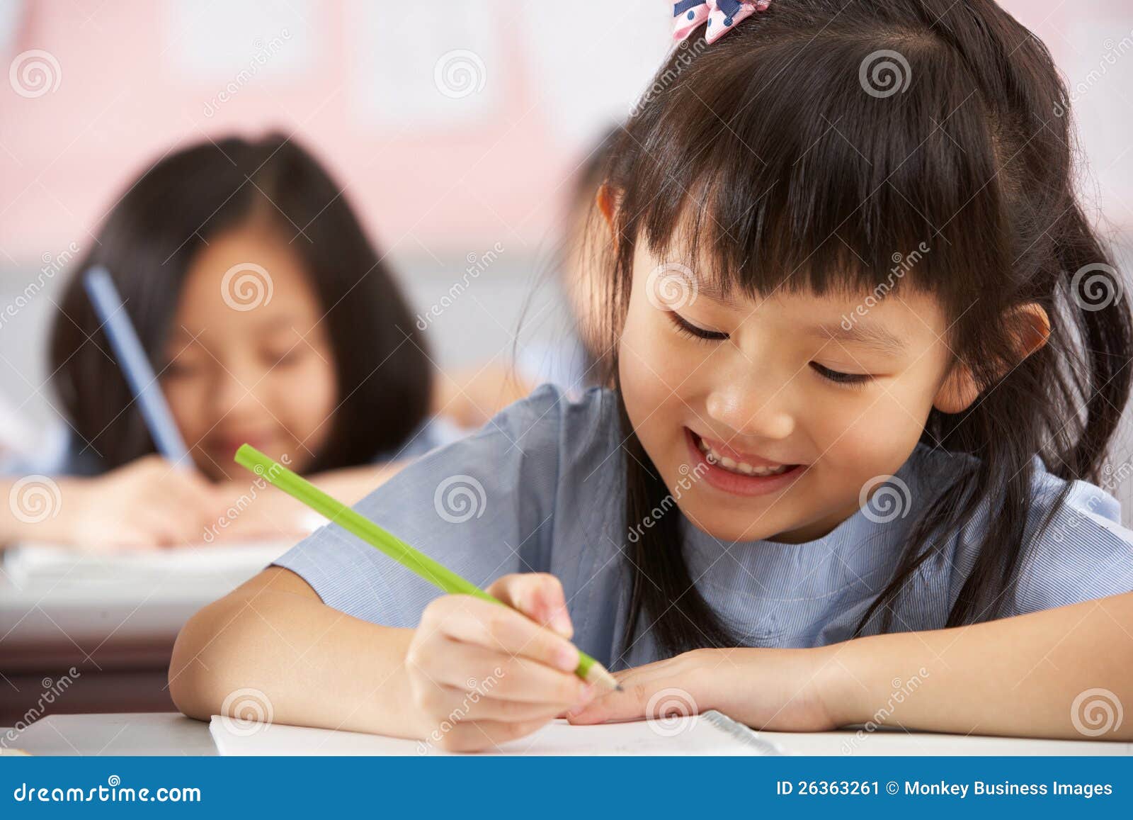 Students Working at Desks in Chinese School Stock Image - Image of kong ...