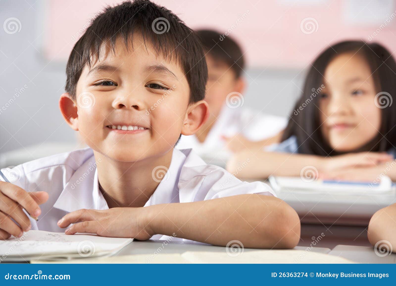 Students Working at Desks in Chinese School Stock Photo - Image of ...
