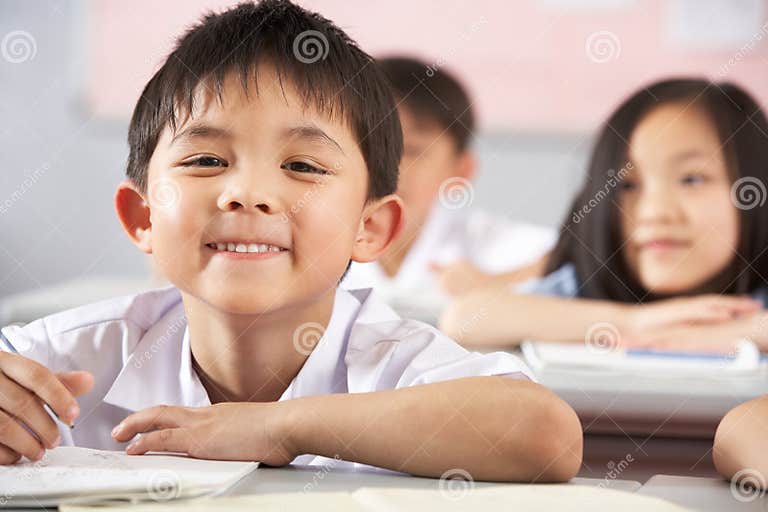Students Working at Desks in Chinese School Stock Photo - Image of ...