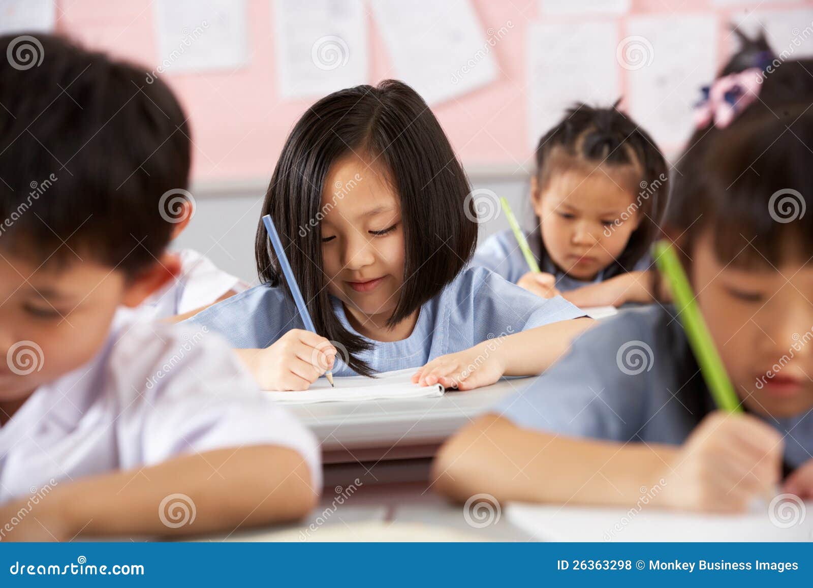 Students Working at Desks in Chinese School Stock Photo - Image of five ...