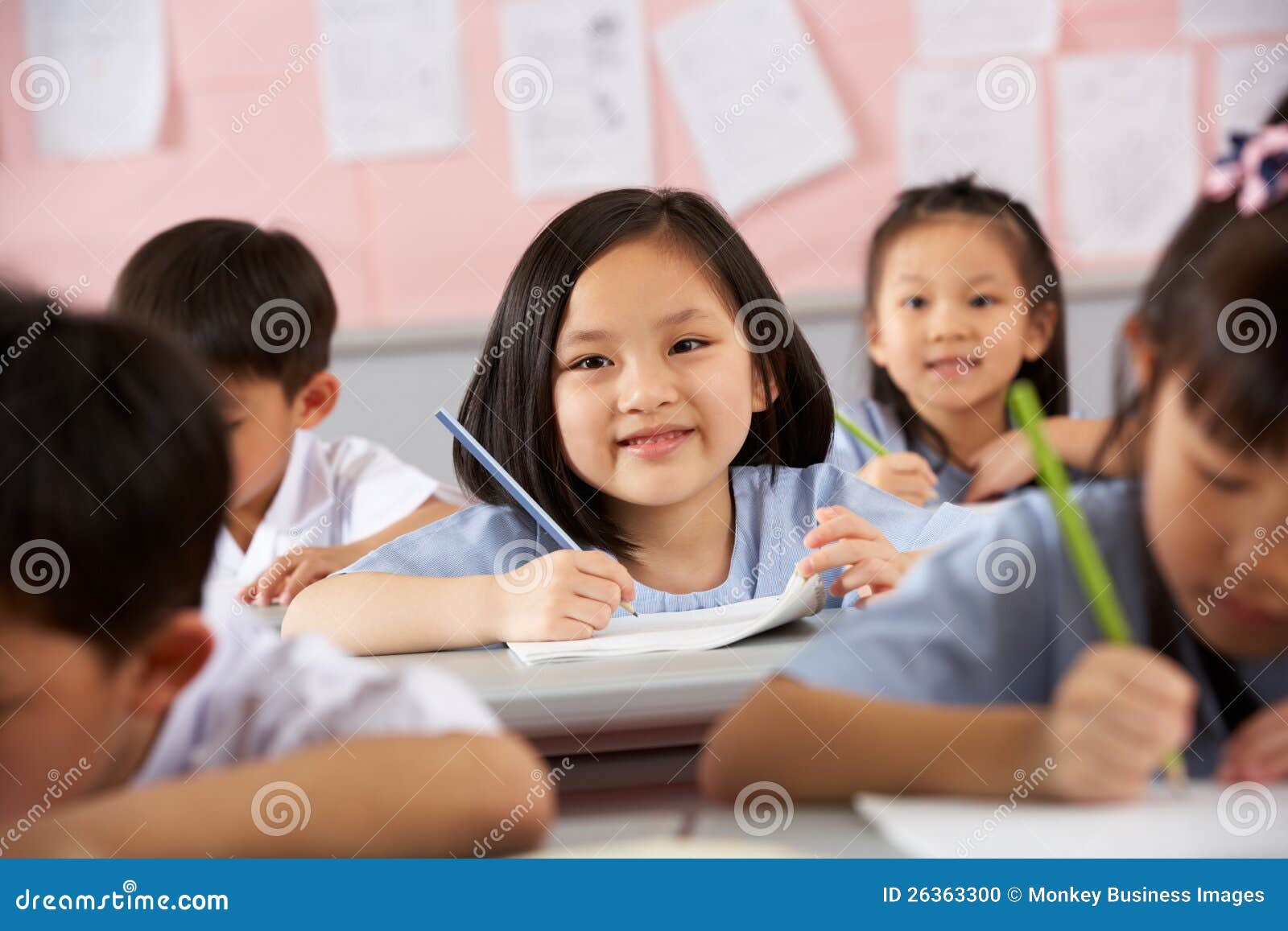 Students Working at Desks in Chinese School Stock Photo - Image of ...