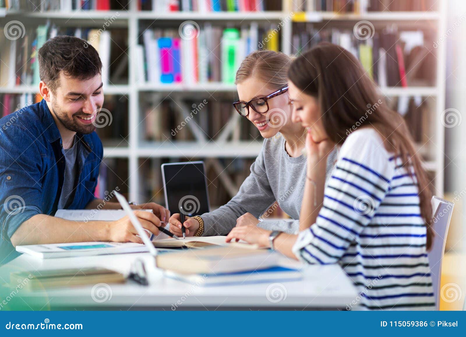 Students Working in the Library at Campus Stock Photo - Image of ...