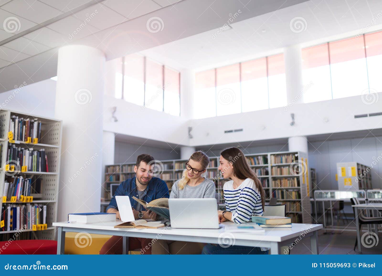 Students Working in the Library at Campus Stock Image - Image of ...